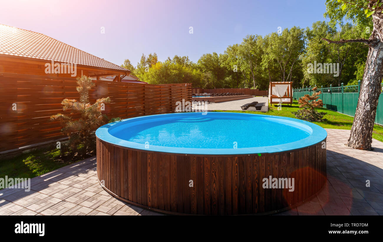 Recreational and relaxing beach scene. Luxury poolside in summer warm ...
