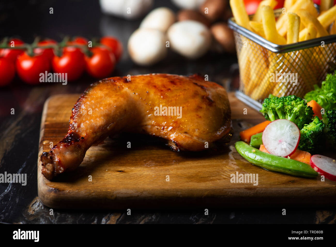 roast drum stick on cutting board Stock Photo - Alamy