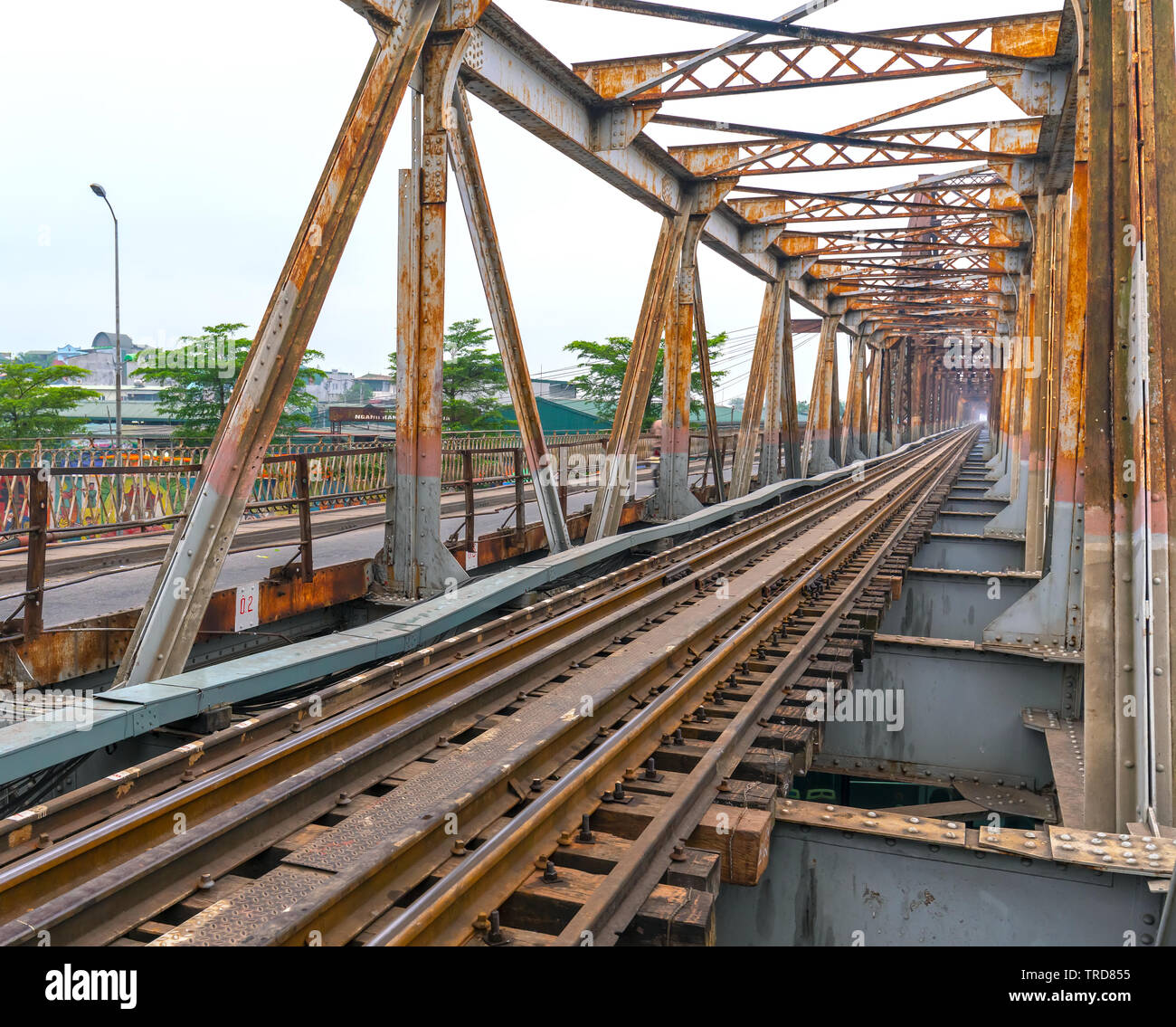 Vintage railroad tracks leading over the famous Long Bien Bridge, Hanoi ...