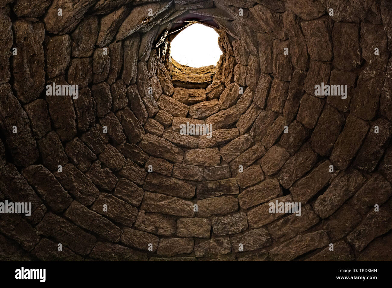 Deep ancient well inside Stock Photo - Alamy