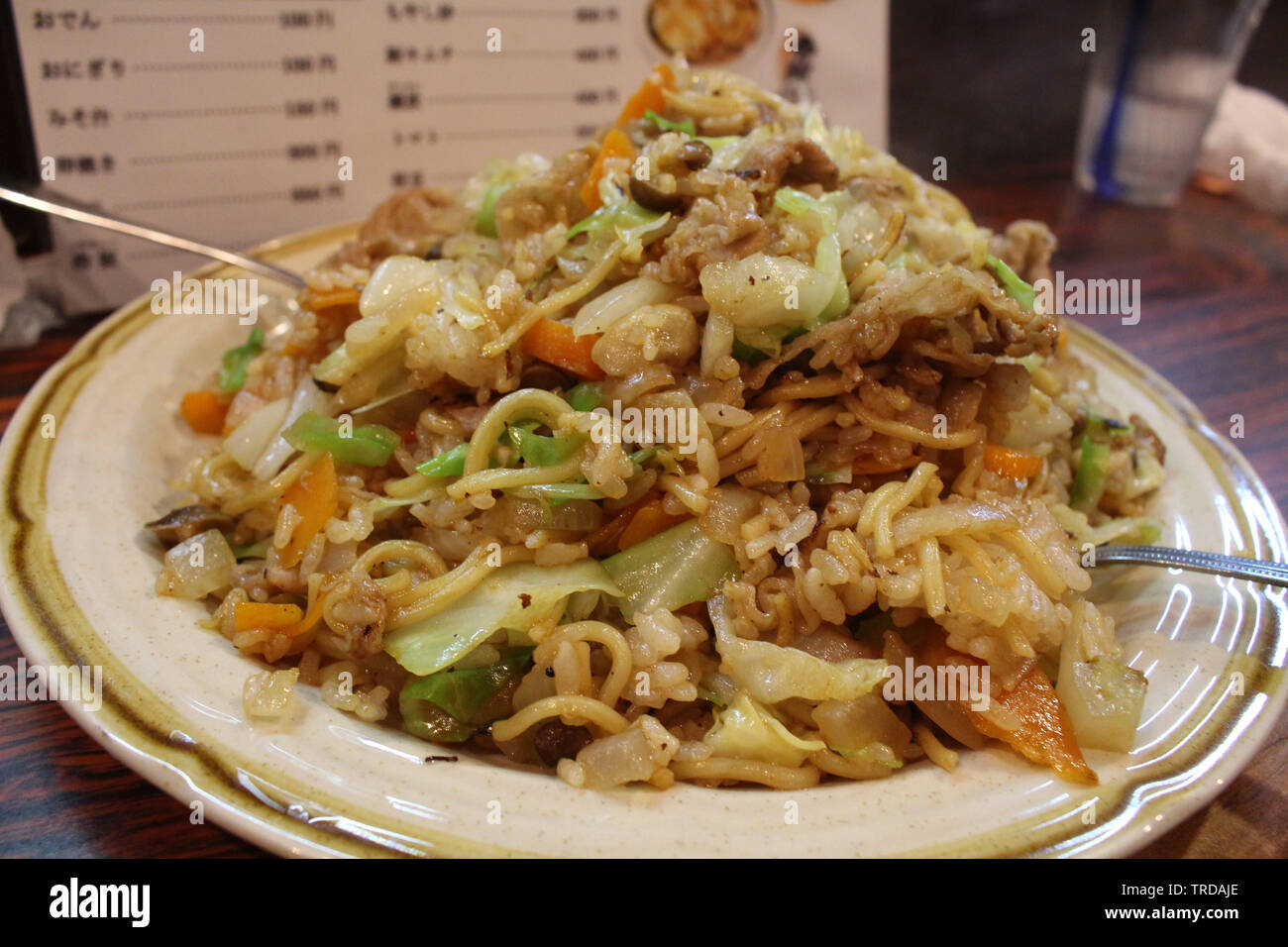 Japanese fried rice or soba meshi served at traditional izakaya. Taken ...