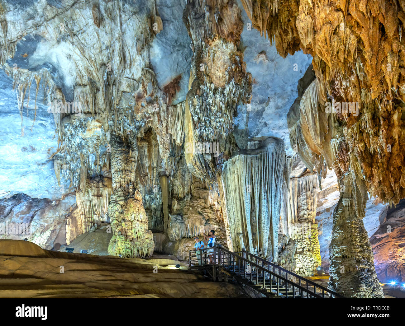 Tourists visit on wooden walkway through scenic natural corridor ...