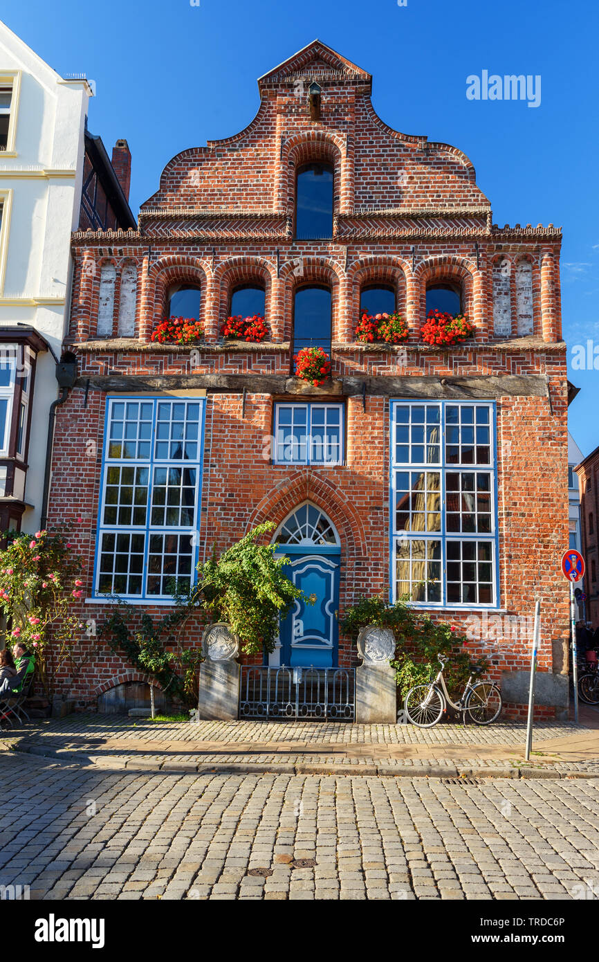 Medieval old brick building with Medieval blue wooden front door ...