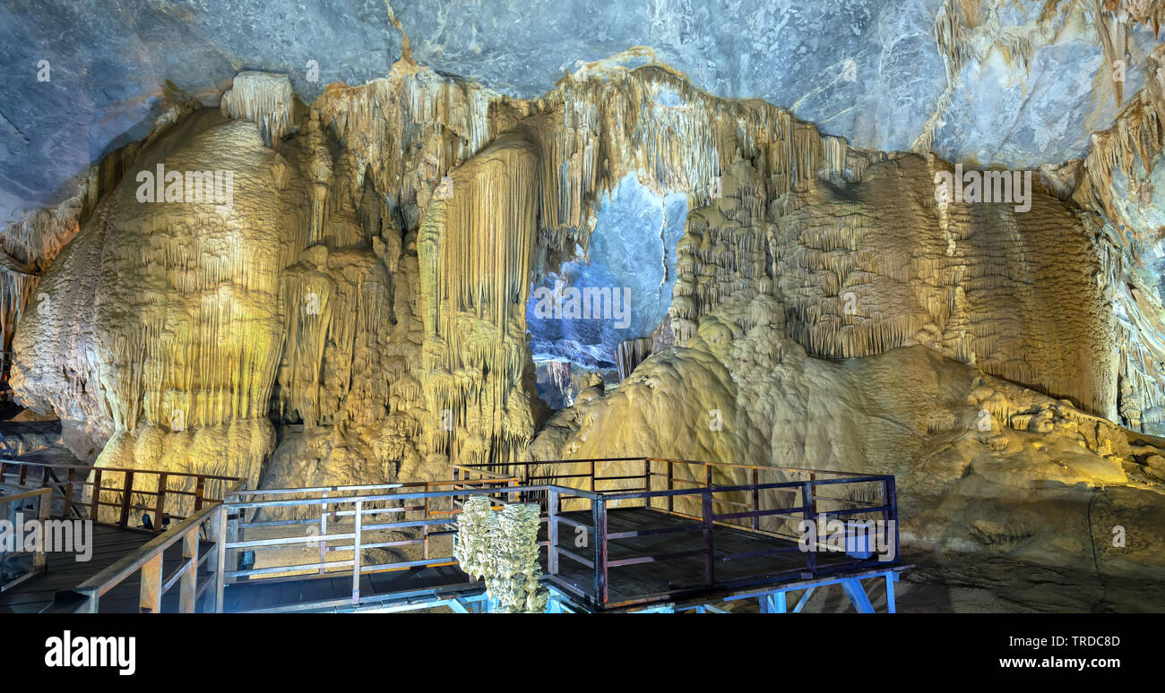 Tourists visit on wooden walkway through scenic natural corridor ...