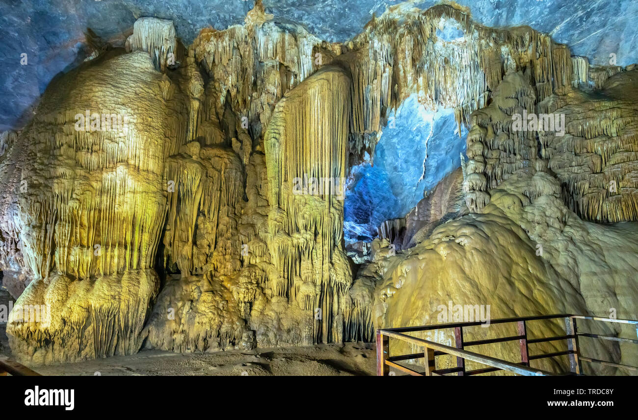Tourists visit on wooden walkway through scenic natural corridor ...