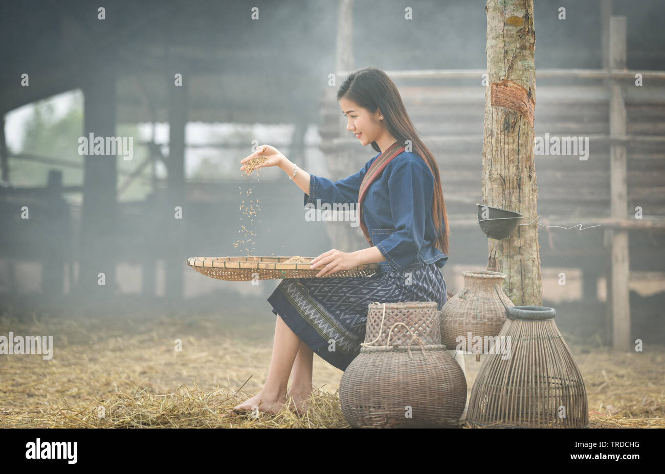 Asian woman winnowing rice / Portrait of beautiful young girl happy ...