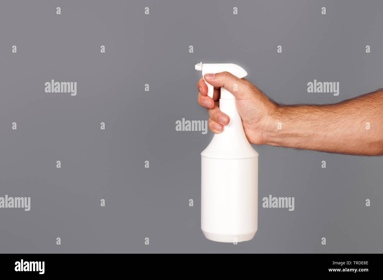 hand holding spray bottle Stock Photo - Alamy