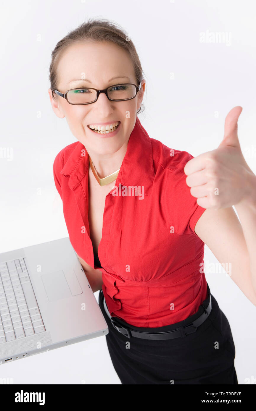 Portrait of a young likeable Business woman holding a laptop and ...