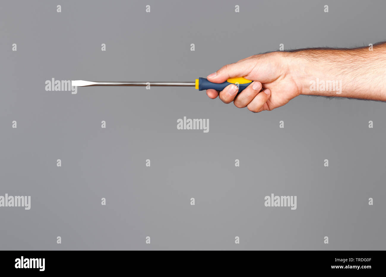 man holding a screwdriver Stock Photo - Alamy