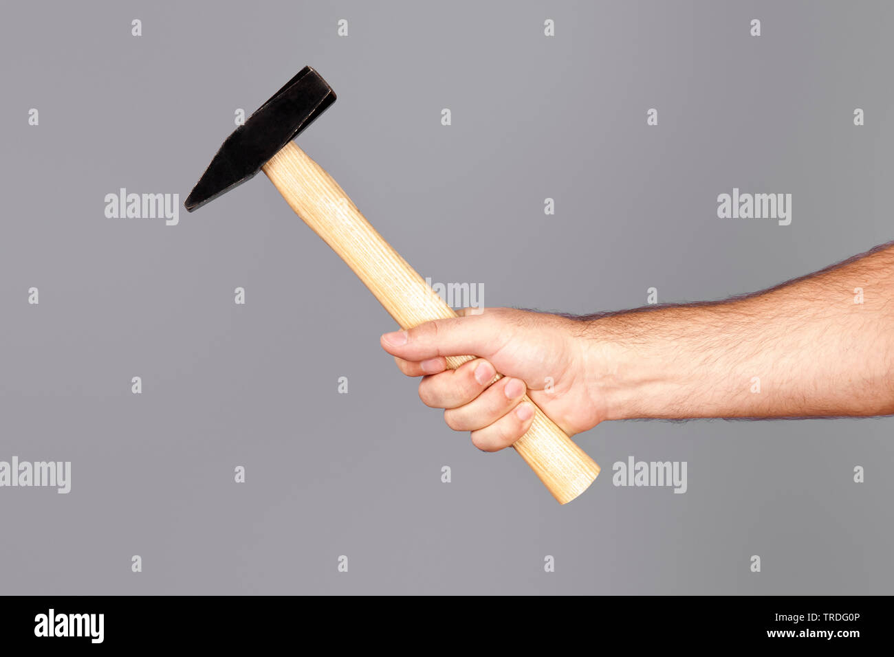 man holding a hammer Stock Photo - Alamy