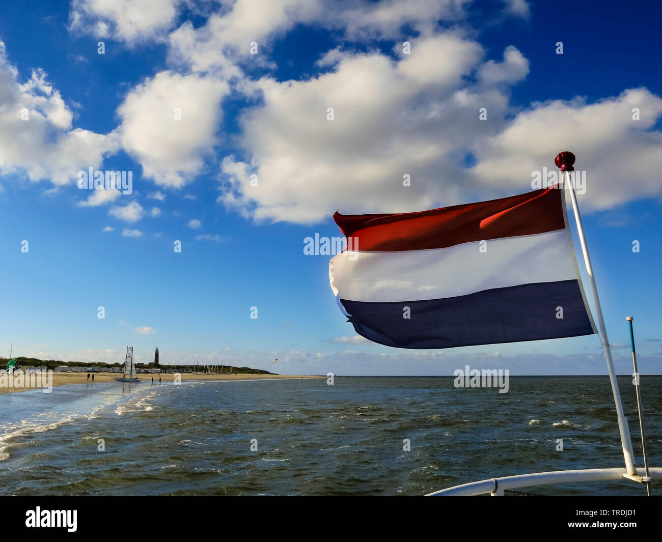 Dutch Flag on boat with beach in background at Texel, Netherlands ...