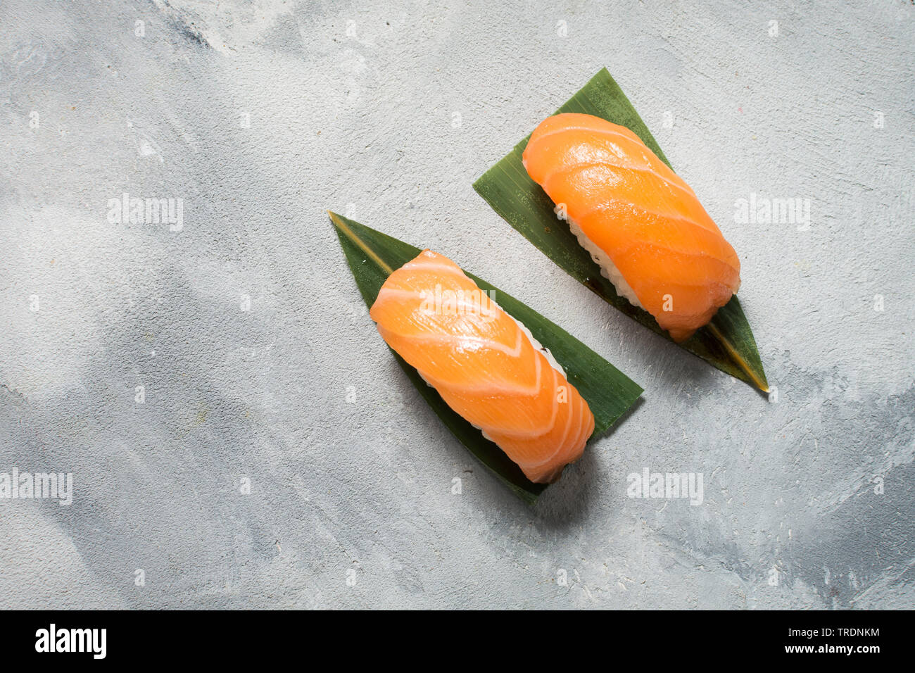 Classic Salmon Sushi on concrete background. Top view. Japanese food ...