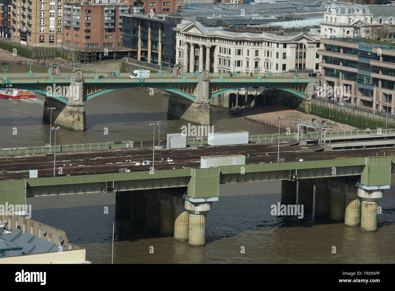 Cannon street railway bridge and beyond, Southwark bridge over the ...