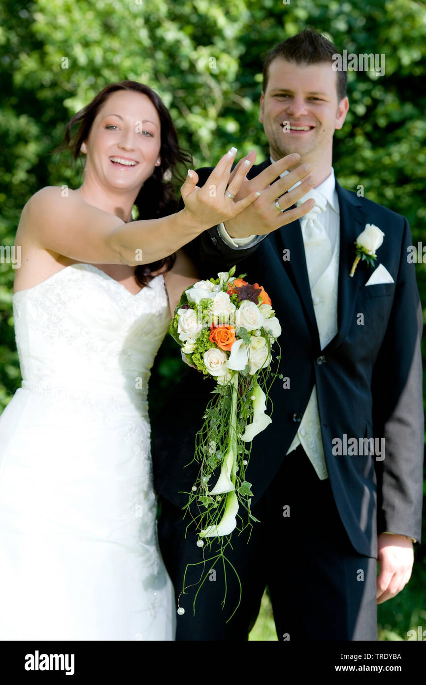 Bridal couple showing off their wedding rings after the ceremony Stock ...
