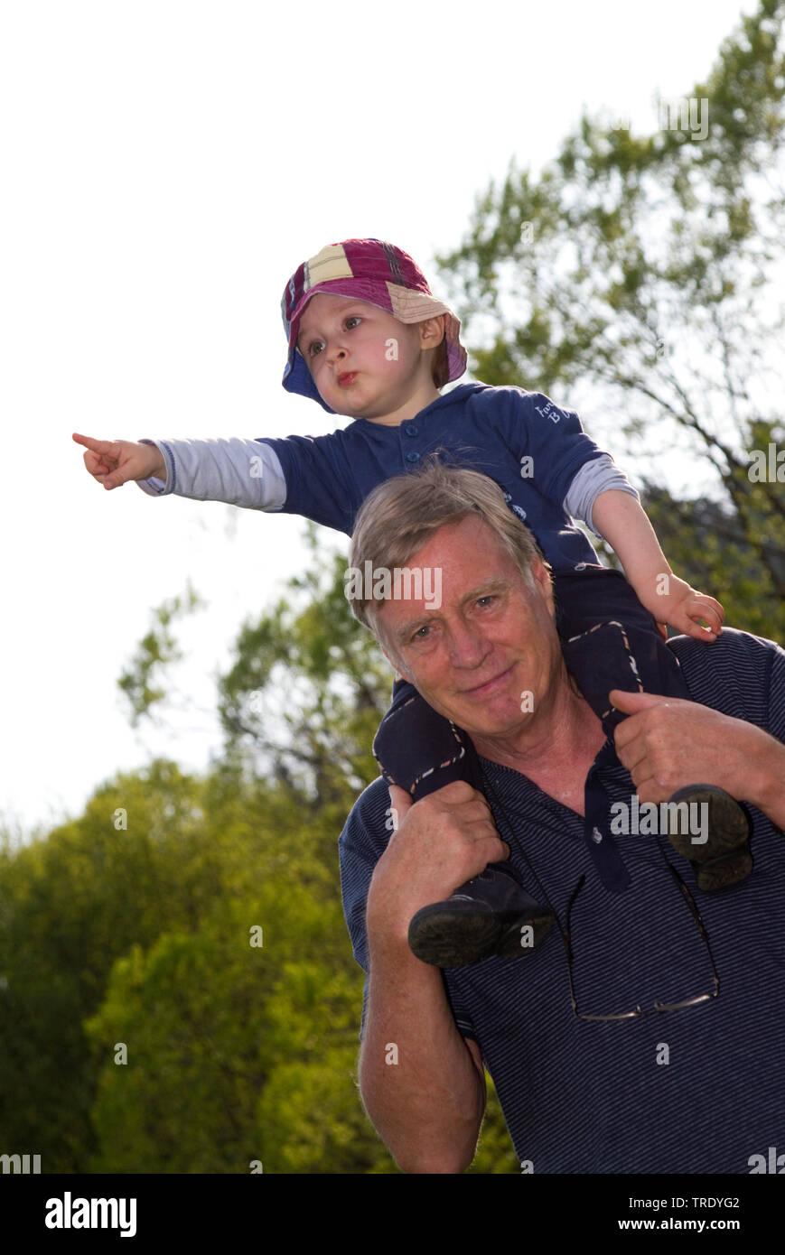 Son sits on fathers shoulders hi-res stock photography and images - Alamy