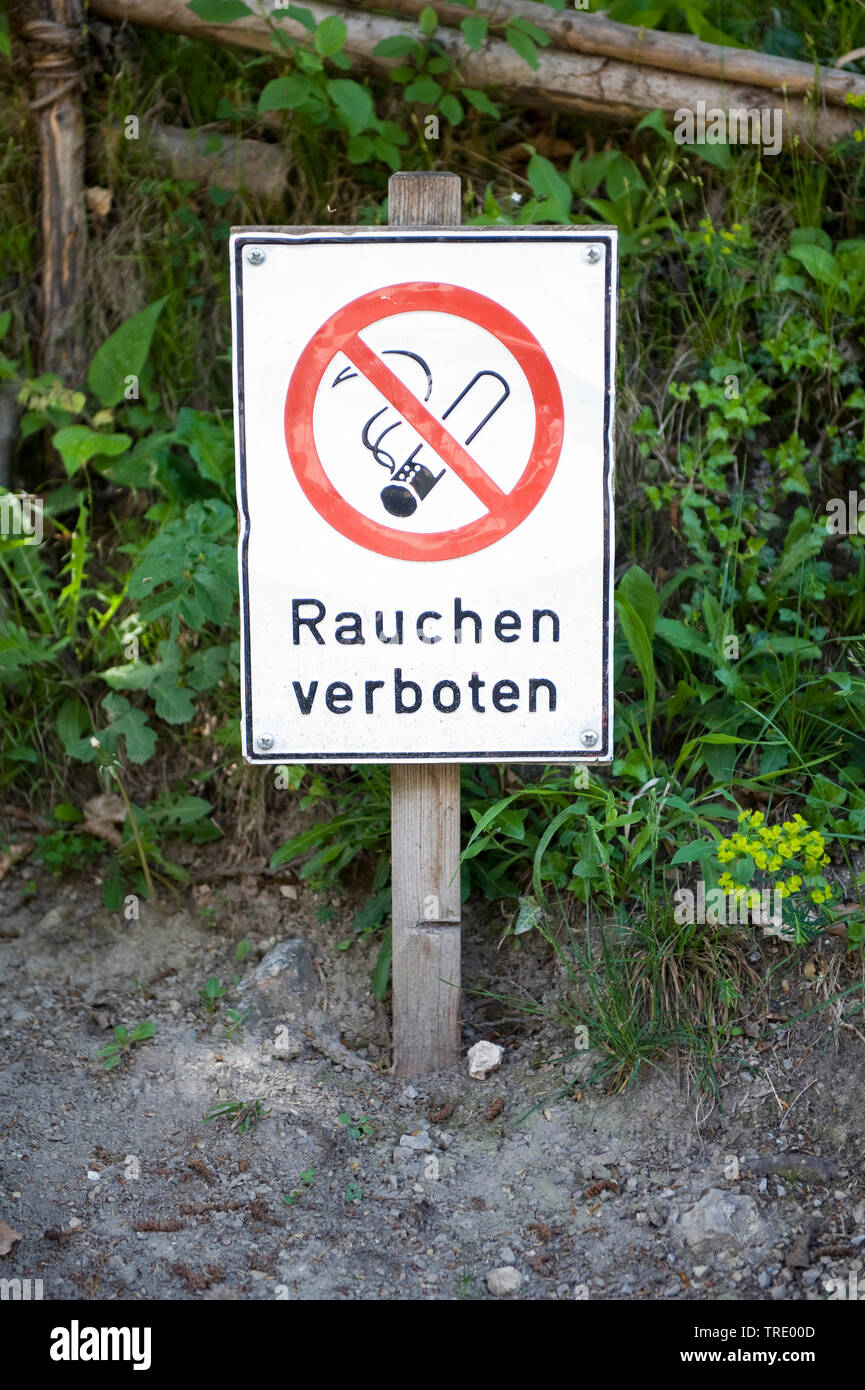 Prohibition sign lettering RAUCHEN VERBOTEN (no smoking) along a ...