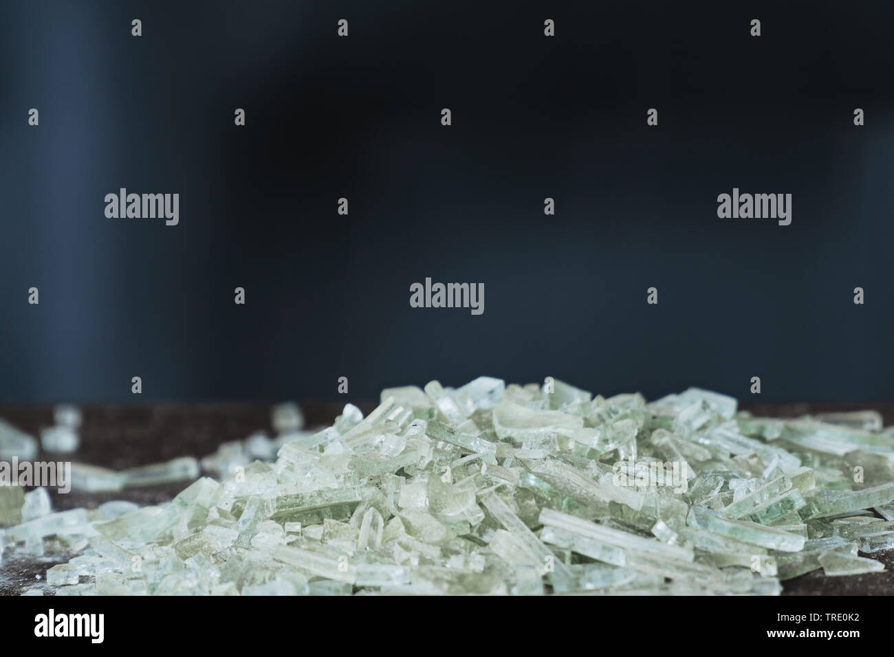 Pile of shattered glass covered with dust and a lot of copy space on ...