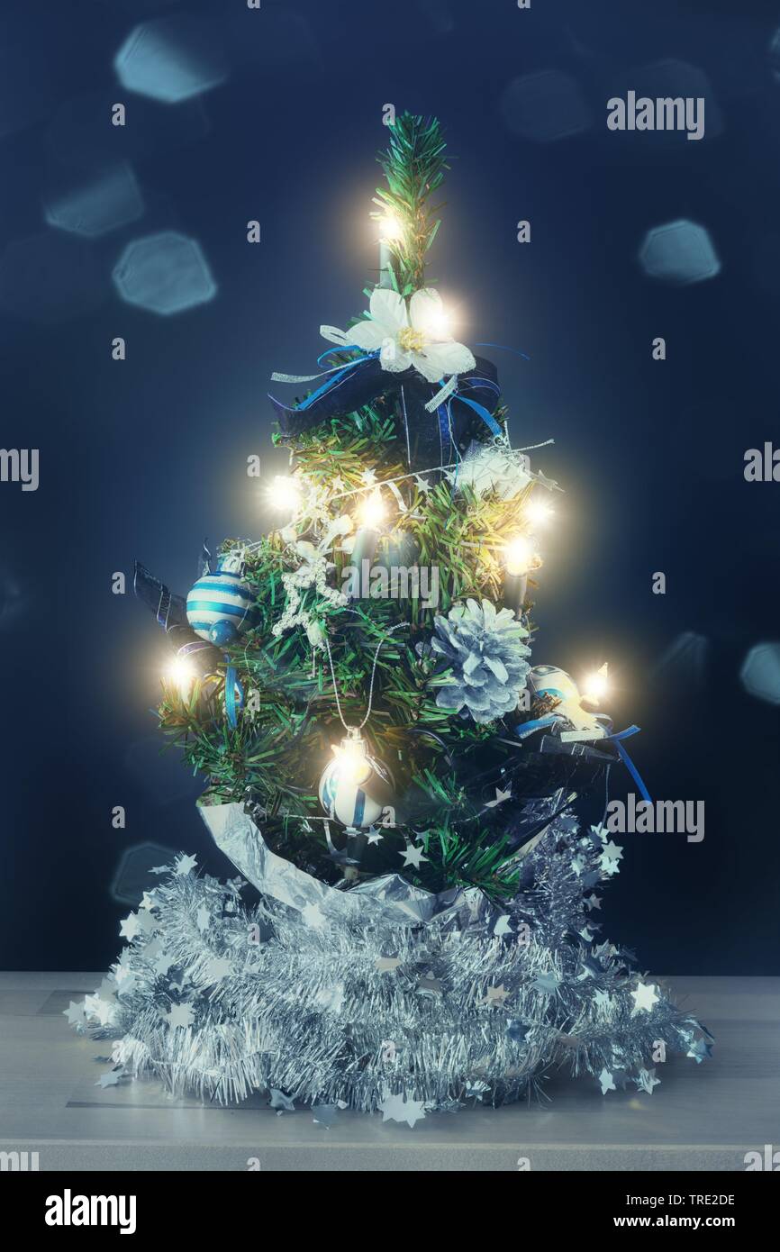 Christmas decoration with Christmas tree and silver garland Stock Photo ...