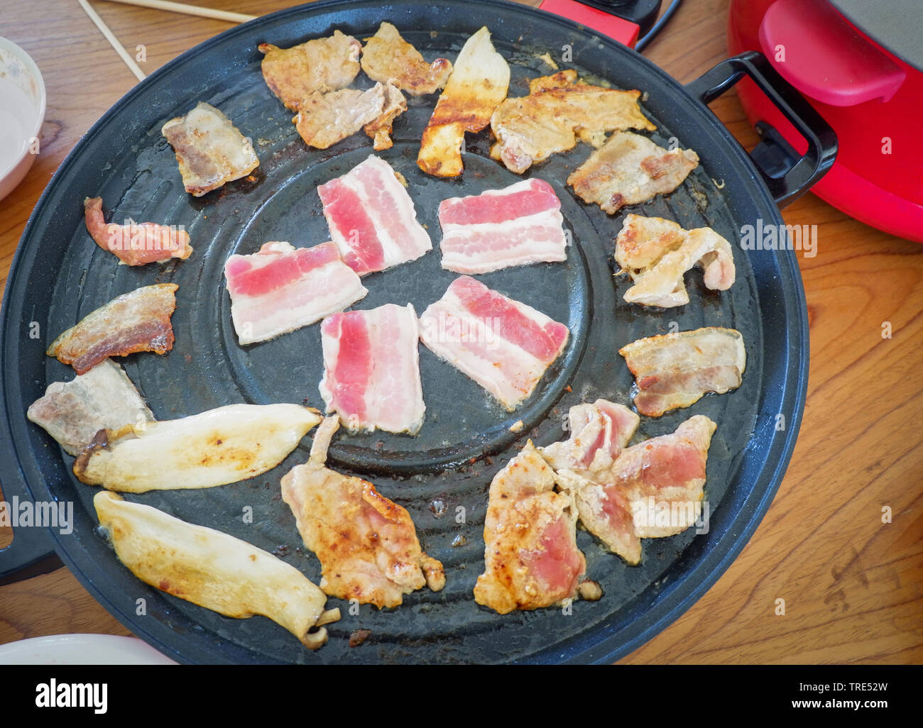 Grilled pork slice and meat on electronic grill Stock Photo - Alamy