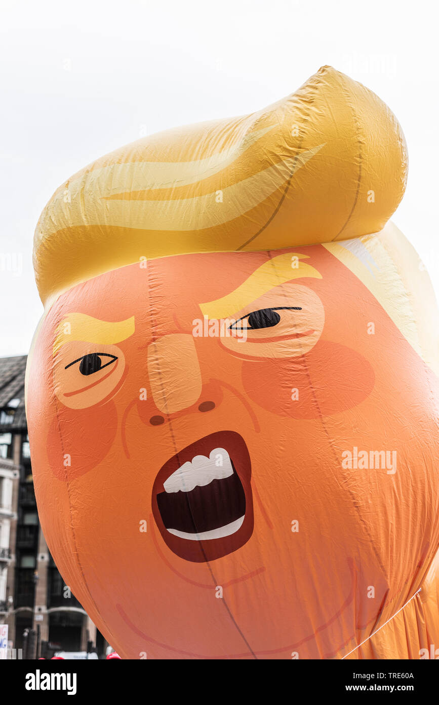 Protesters inflating a huge Donald Trump effigy balloon blimp outside ...