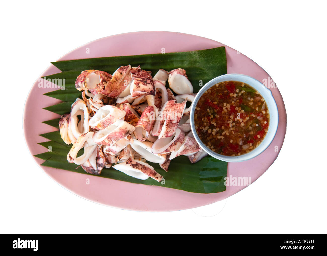 Grilled squid slice on plate banana leaf isolated on white background ...