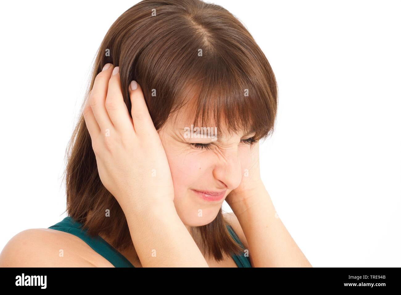 Young women with closed eyes, shutting both hers ears Stock Photo - Alamy