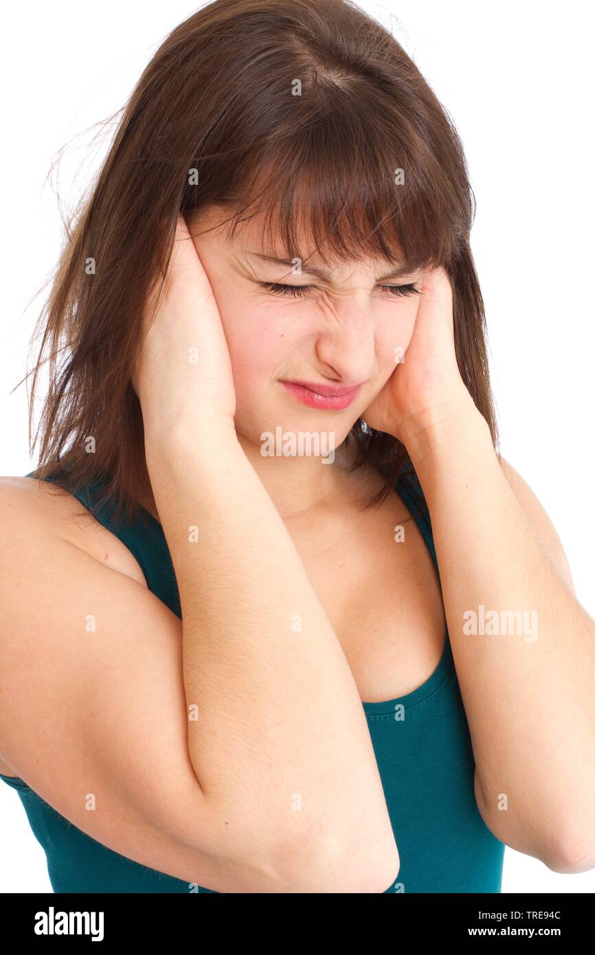 Young women with closed eyes, shutting both hers ears Stock Photo - Alamy