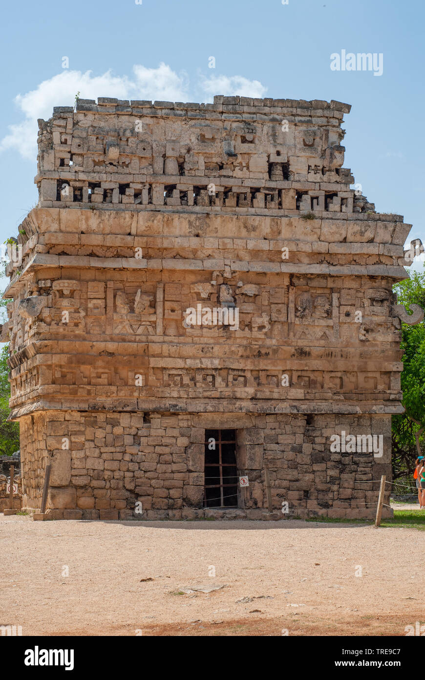 Small Mayan temple, adorned with engraved stones, in the archaeological ...