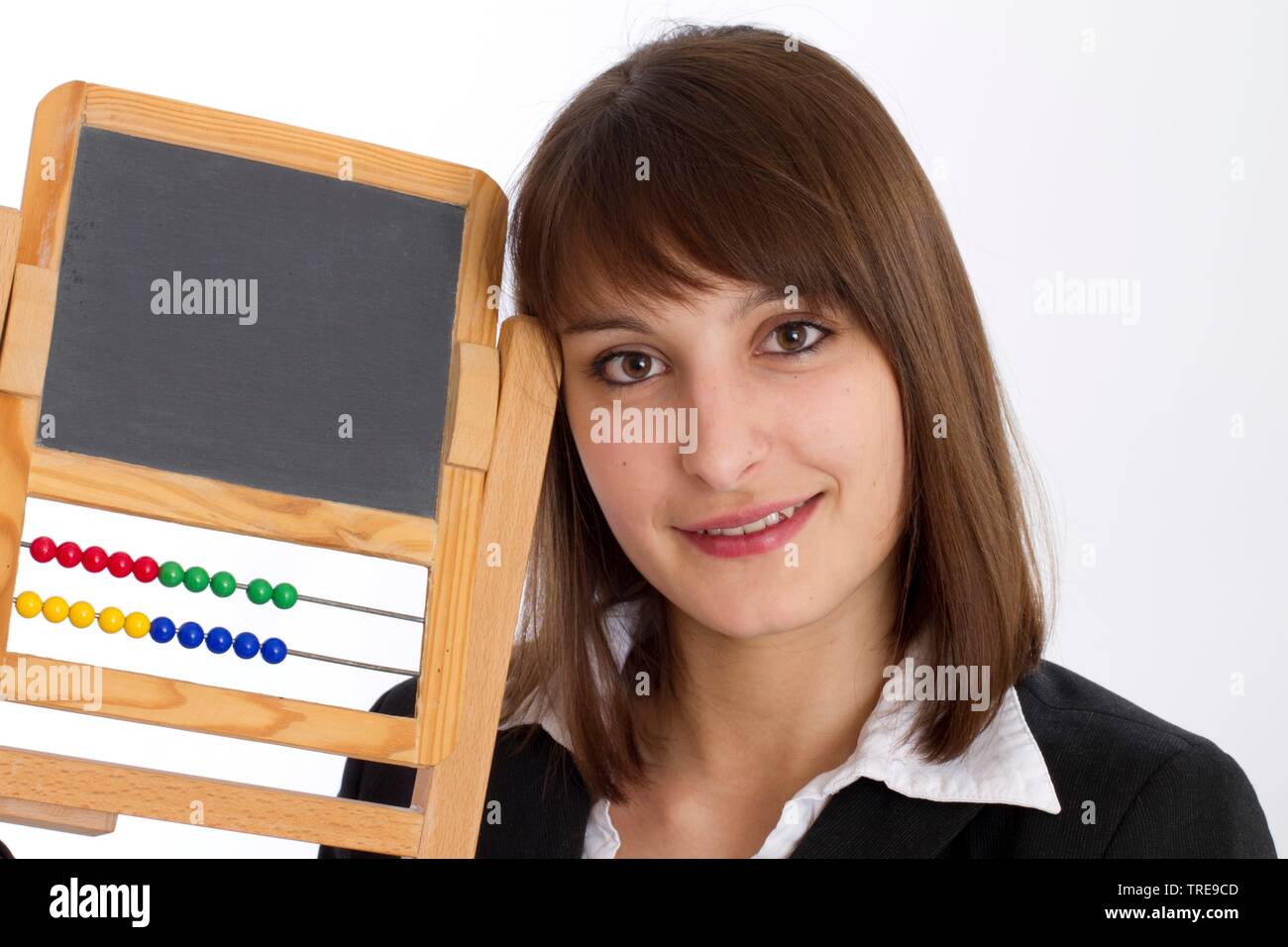 Young likeable women with a children blackboard and a rainbow abacus ...