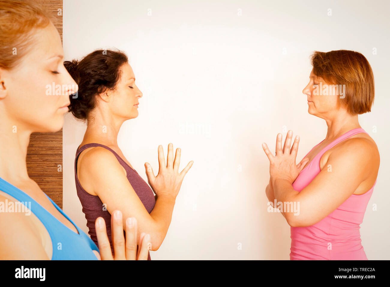 Group three people doing yoga hi-res stock photography and images - Alamy