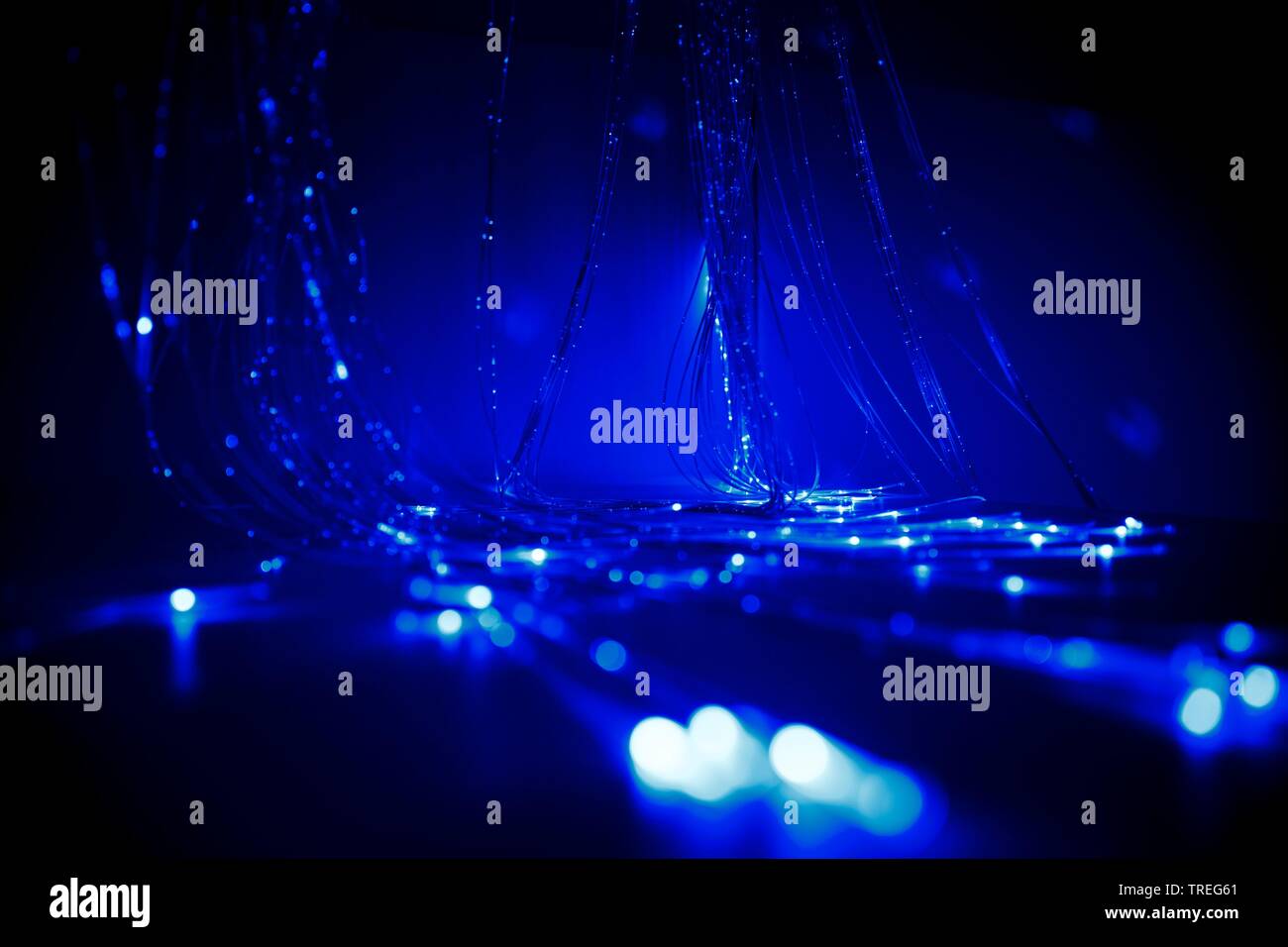 3D computer graphic, fieber optic cables light up in blue color - light ...