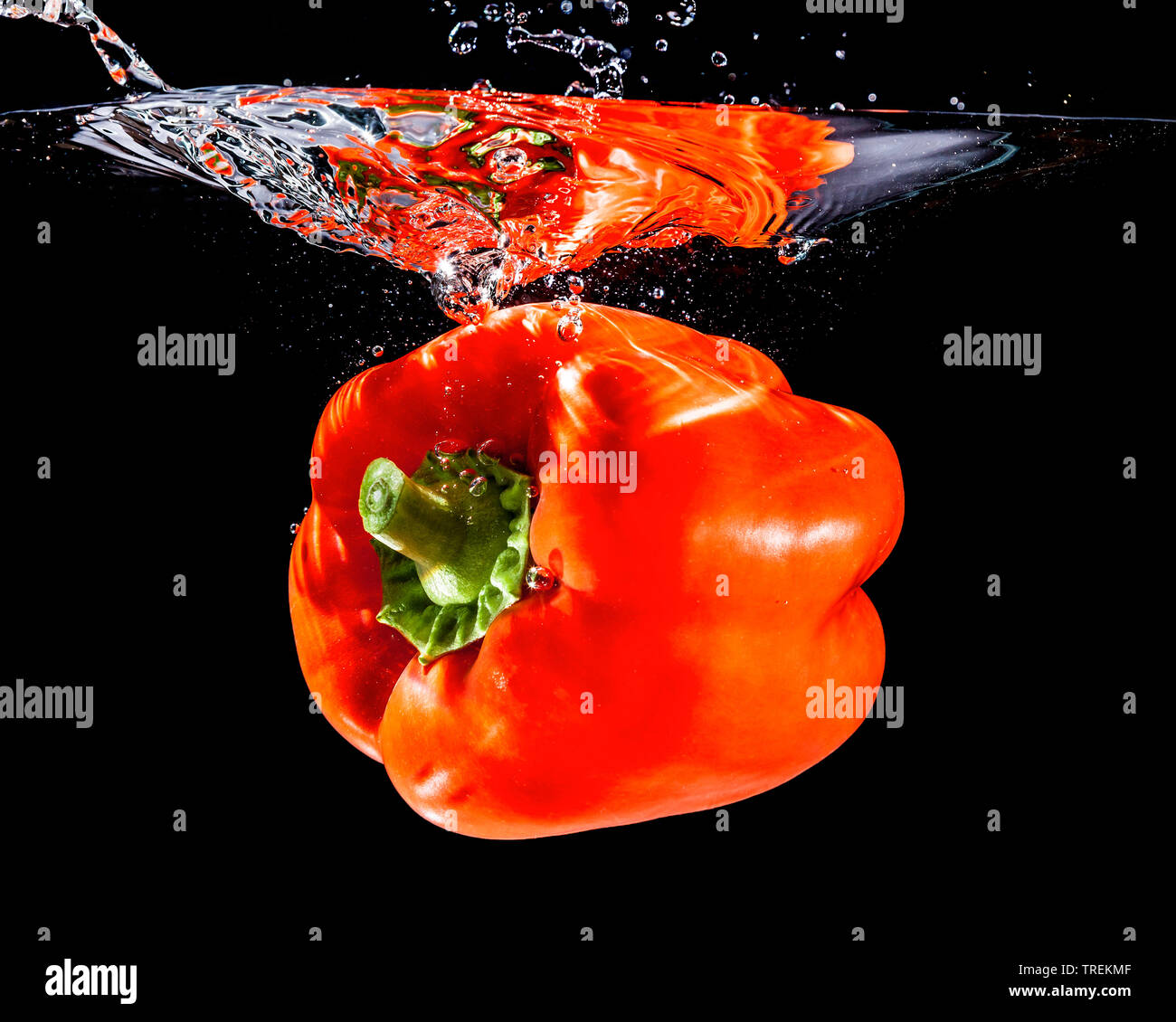 Red pepper, paprika (Capsicum annuum), falling into the water Stock ...