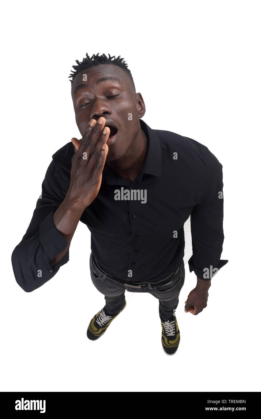 Young sleepy man yawning Cut Out Stock Images & Pictures - Alamy