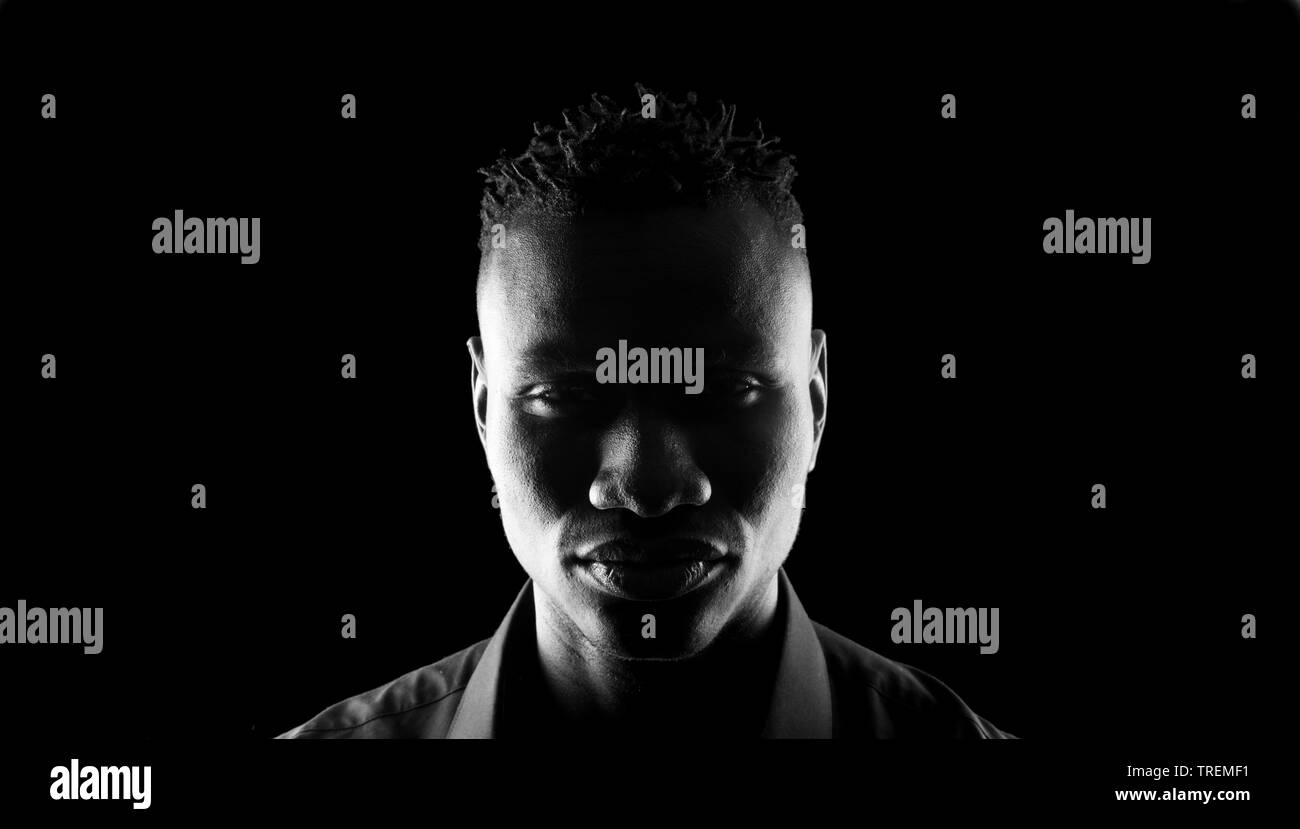 Man posing in dark Black and White Stock Photos & Images - Alamy