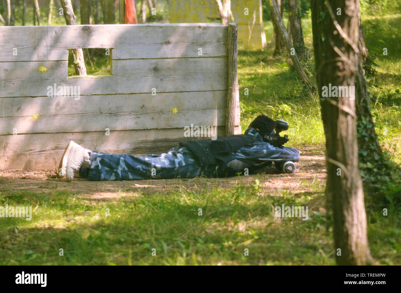 Paintball battle. The battlefield is equipped with barriers: they allow ...