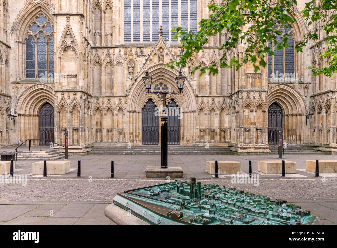 The West facing doors of York Minster with a model of the historic city ...
