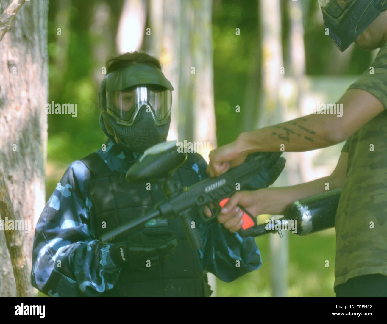 Paintball battle. In the breaks staff staff helps the players in the ...