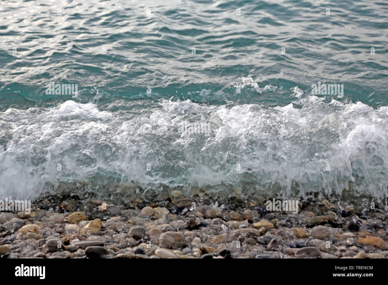 Sea, wave, coastal stones in background Stock Photo - Alamy