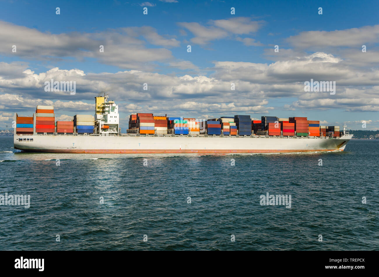 Container Ship in Navigation under Blue Sky with clouds Stock Photo - Alamy
