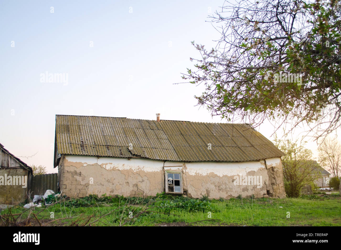 Old ruined house in the countryside. Emergency housing. Disaster. Storm ...