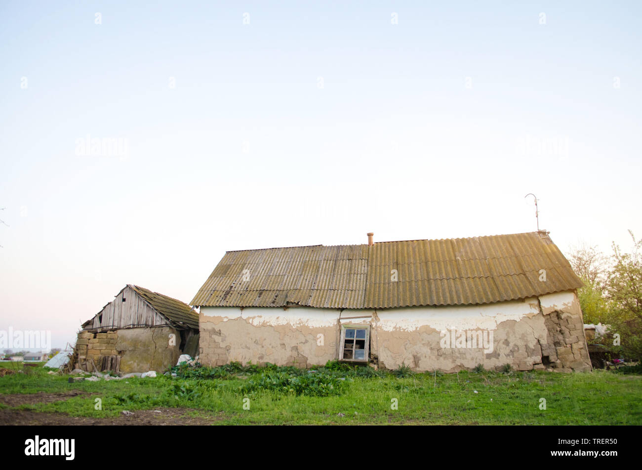 Old ruined house in the countryside. Emergency housing. Disaster. Storm ...