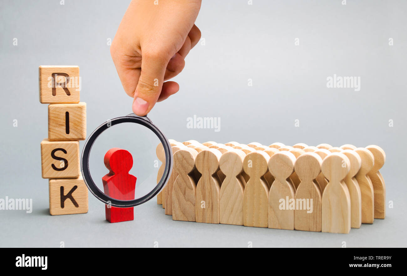 Wooden blocks with the word Risk and a team with a leader. Business ...