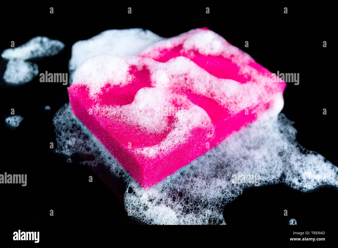 Cleaning sponge with foam for dish washing on black background Stock ...