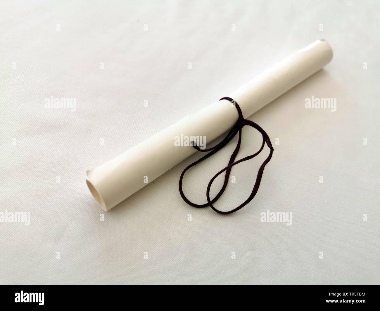 Parchment scroll vellum on a table detail Stock Photo - Alamy