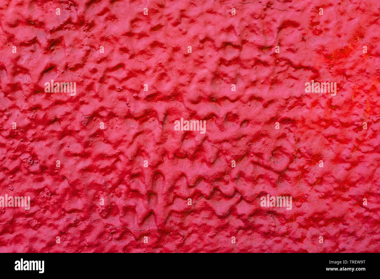 Background of a red stucco coated and painted exterior, rough cast of ...
