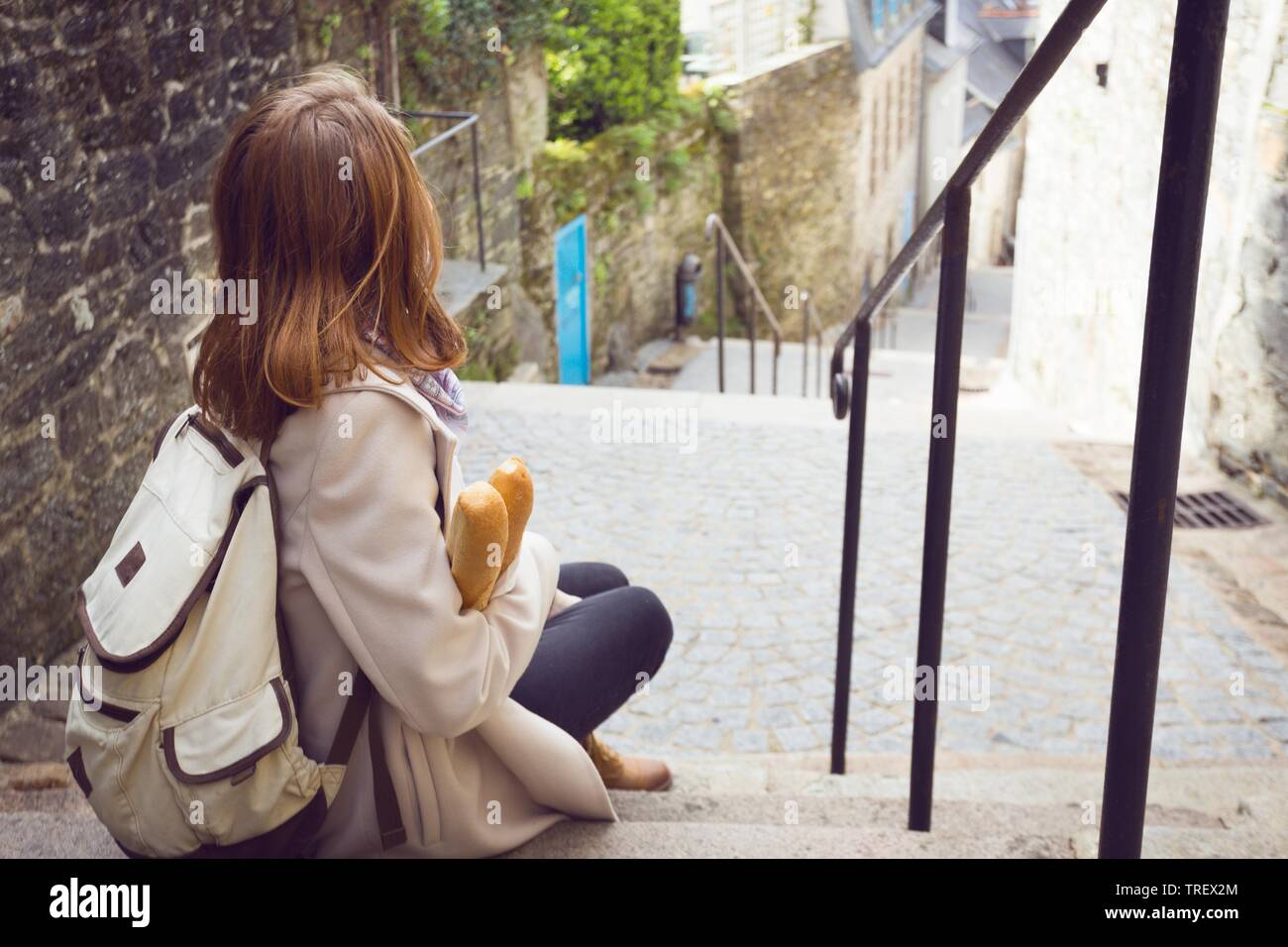 French girl with baguettes on the street side of the city. France Stock ...