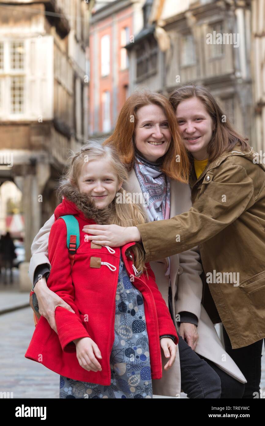 happy mother and daughters in the famous city of Dinan. Normandy ...