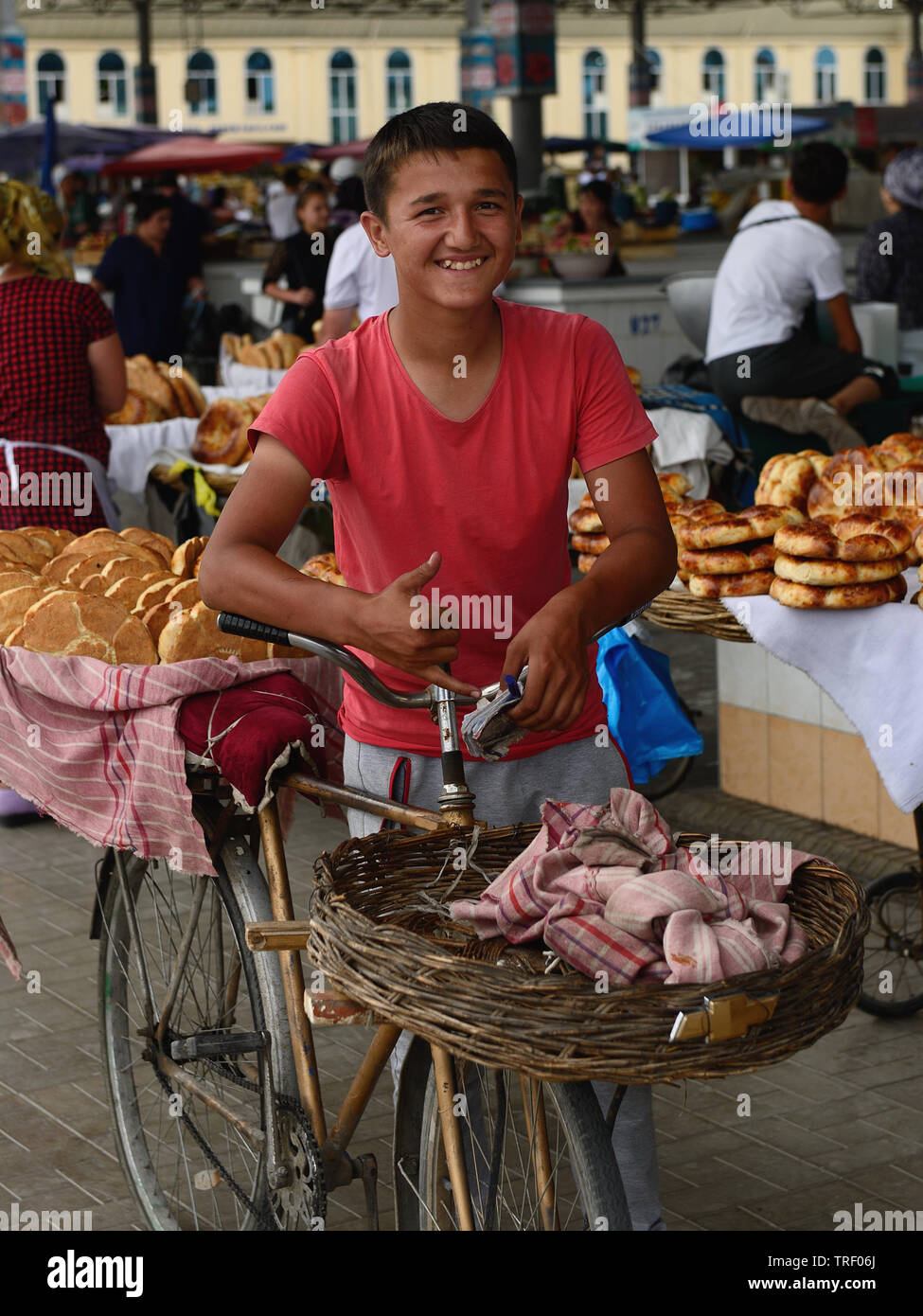 Margilan, Fergana Valley, Uzbekistan - 4 June 2019: Young men selling ...