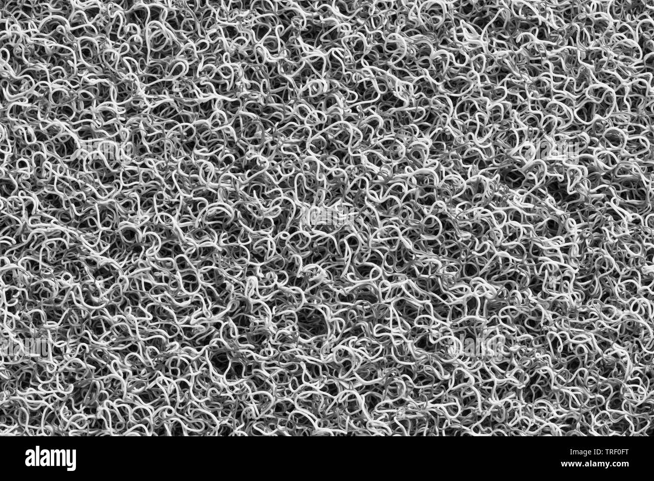 Plastic threads of carpet Black and White texture Background Stock ...