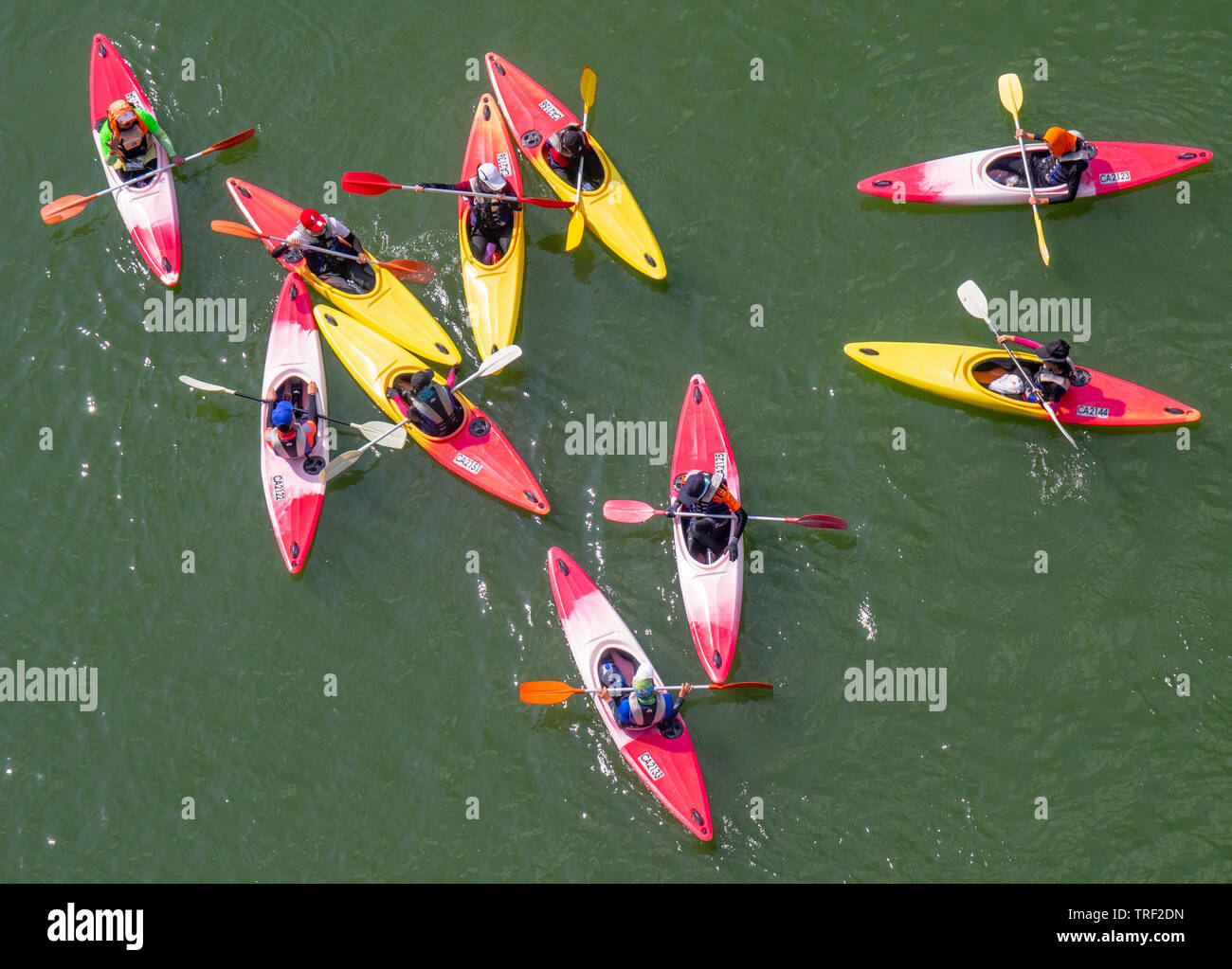 Boys paddling their kayaks kayaking on Marina Bay Singapore Stock Photo ...